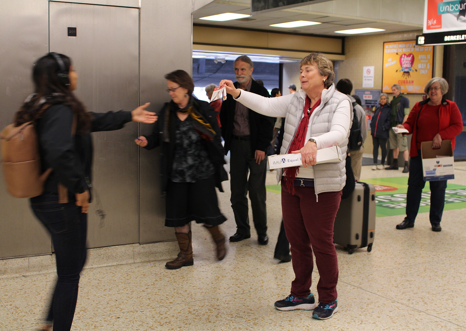 Supporters pass out candy bars to encourage an equal "Payday" for women ...
