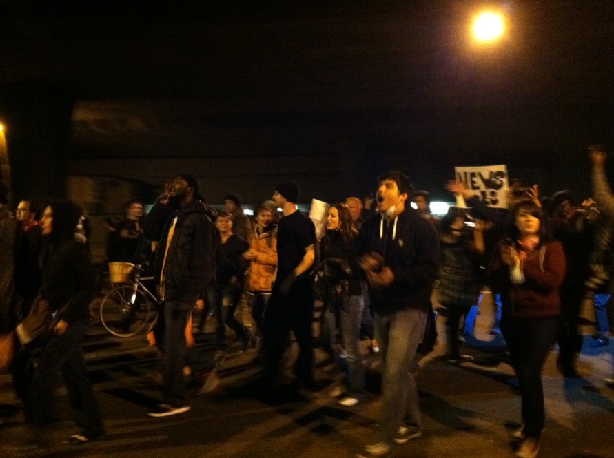 Late-night Occupy Oakland crowd marches jubilantly through city streets ...