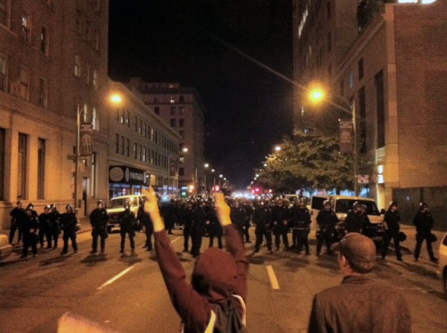 Late-night Occupy Oakland crowd marches jubilantly through city streets ...