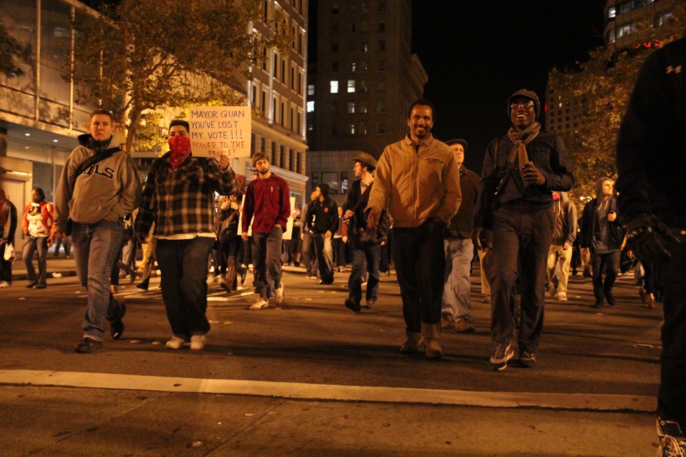 Late-night Occupy Oakland crowd marches jubilantly through city streets ...